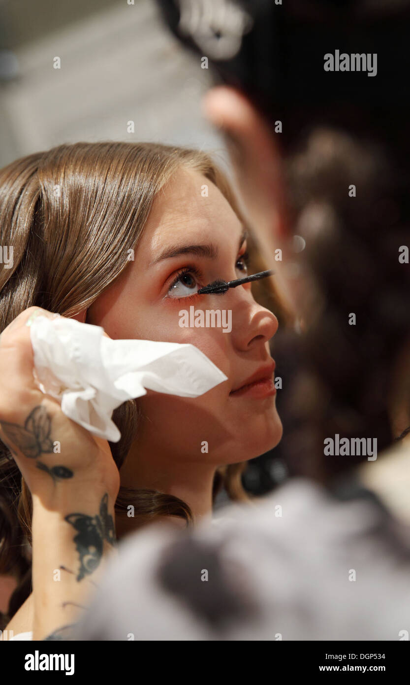 Berlin, Germany, makeup is applied in the models at Fashion Week Stock ...