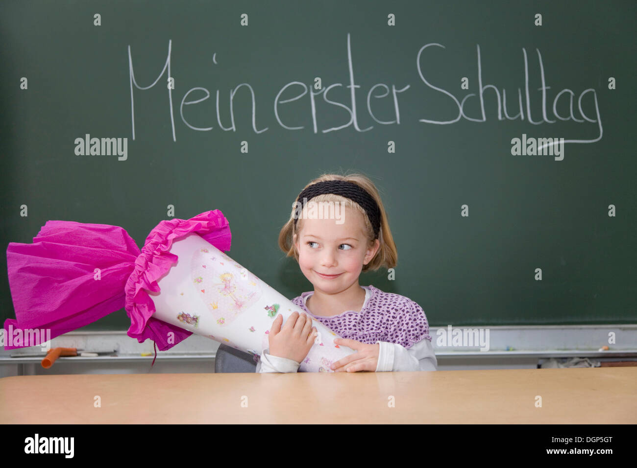 Girl with a cone of sweets on her first day of school Stock Photo - Alamy