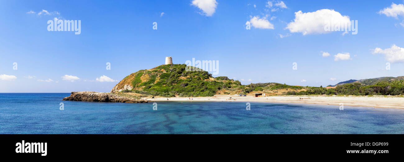 Sandy bay of Torre di Chia with the Saracen Tower with the same name on ...