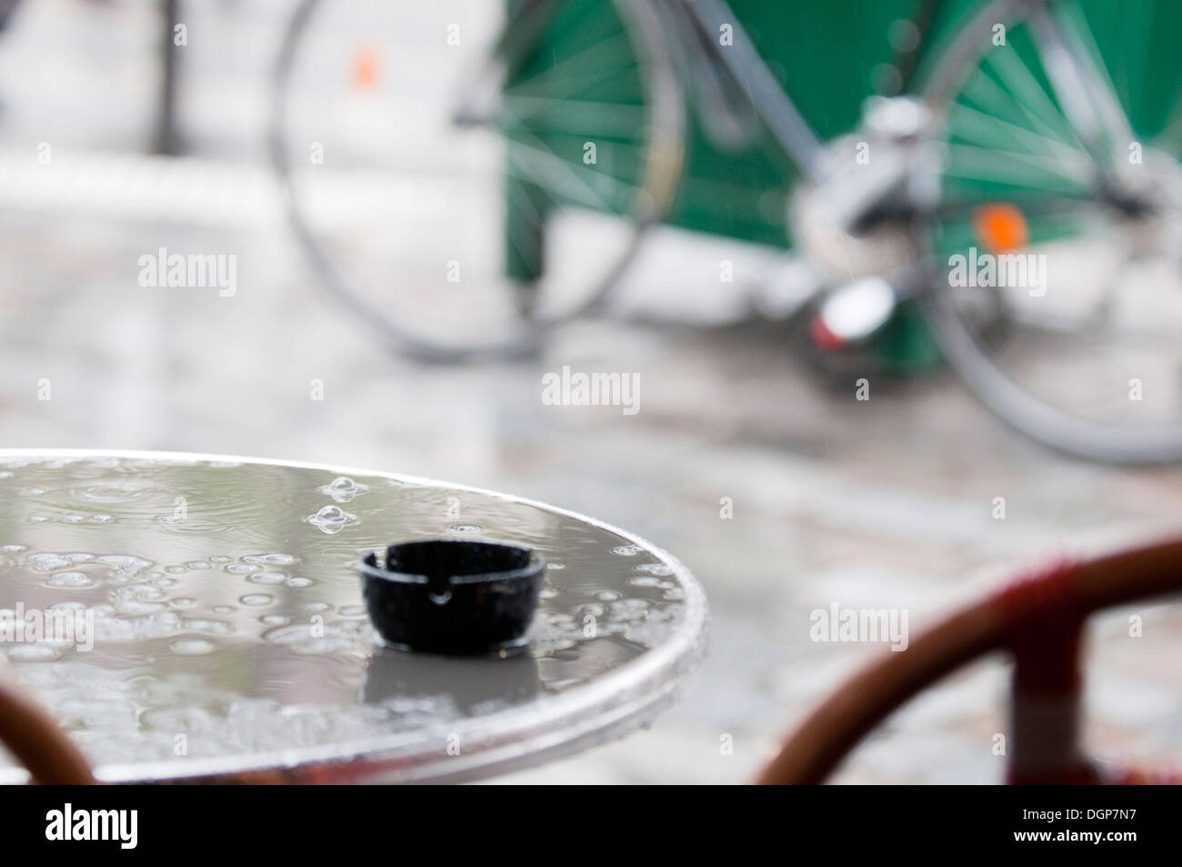 Raindrops cover café table in Paris, France Stock Photo - Alamy