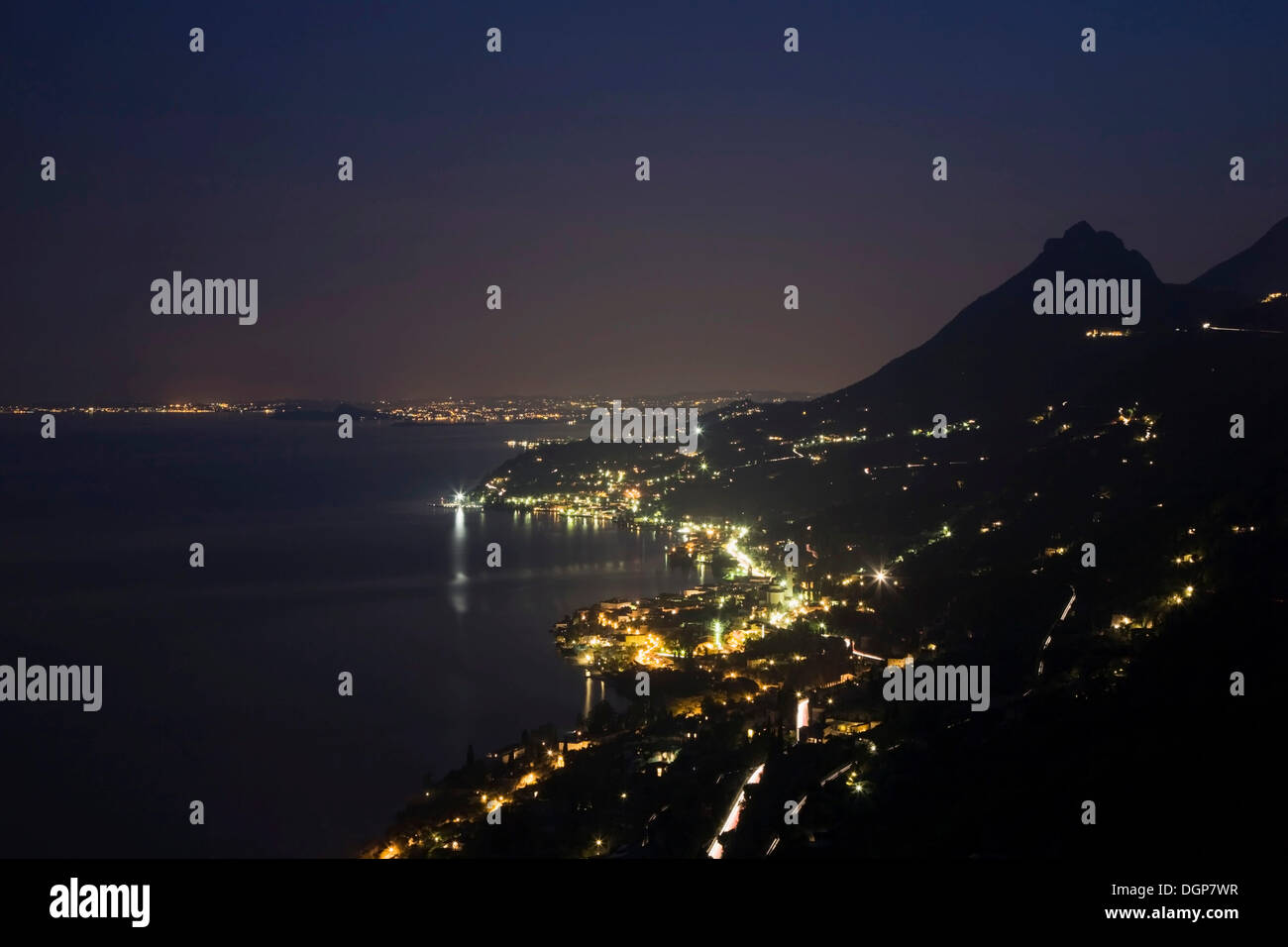 View of Gargnano at night, in the back Monte Pizzocolo, Lake Garda ...