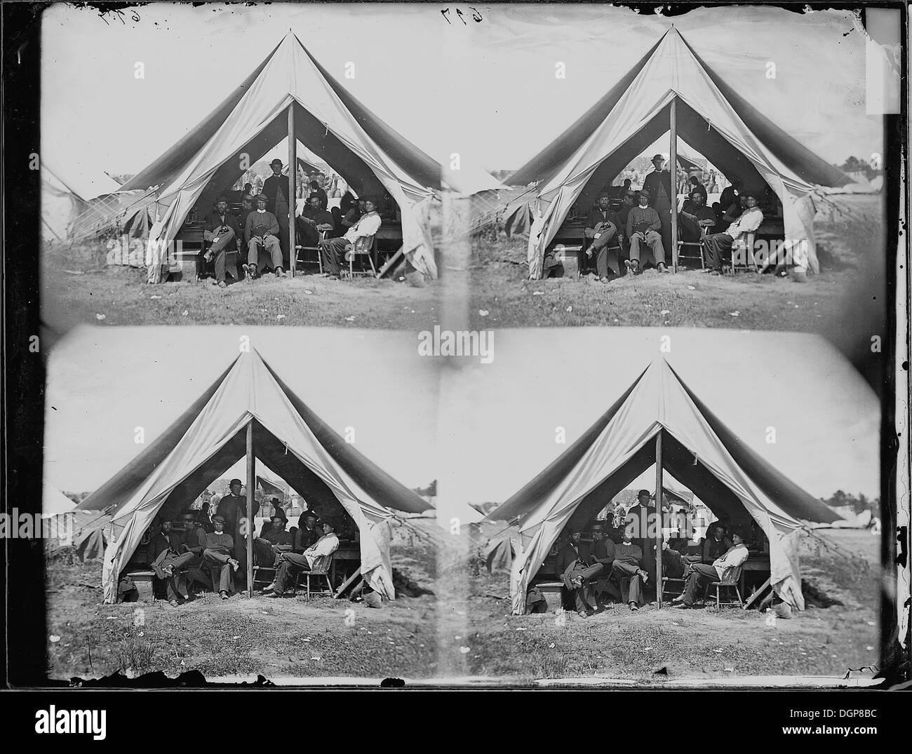 A group of infantry soldiers is seen inside a tent, likely during a ...