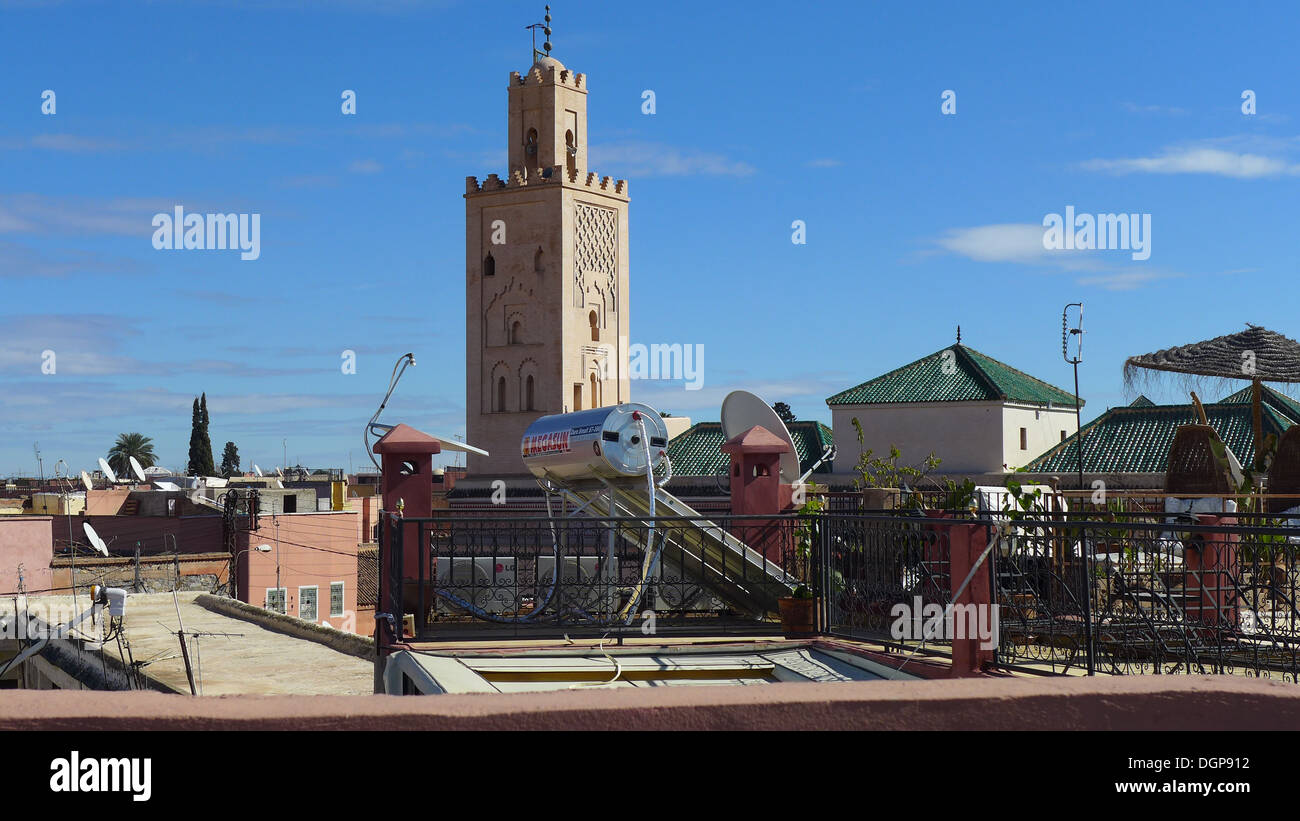 Morocco - Marrakesh Rooftop scene with minaret and solar water heater ...