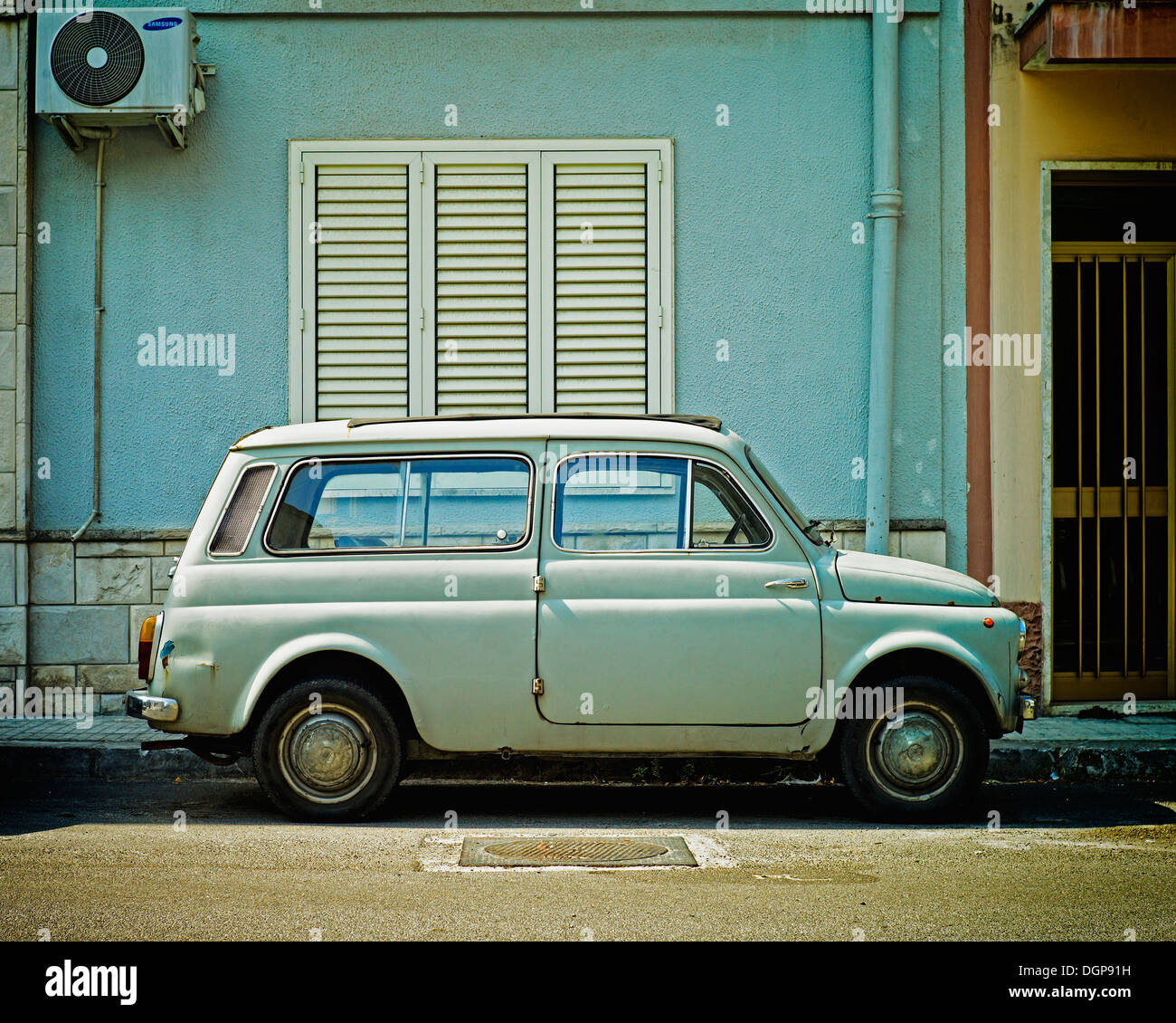 Italy, Old blue fiat 500 in front of blue wall Stock Photo - Alamy