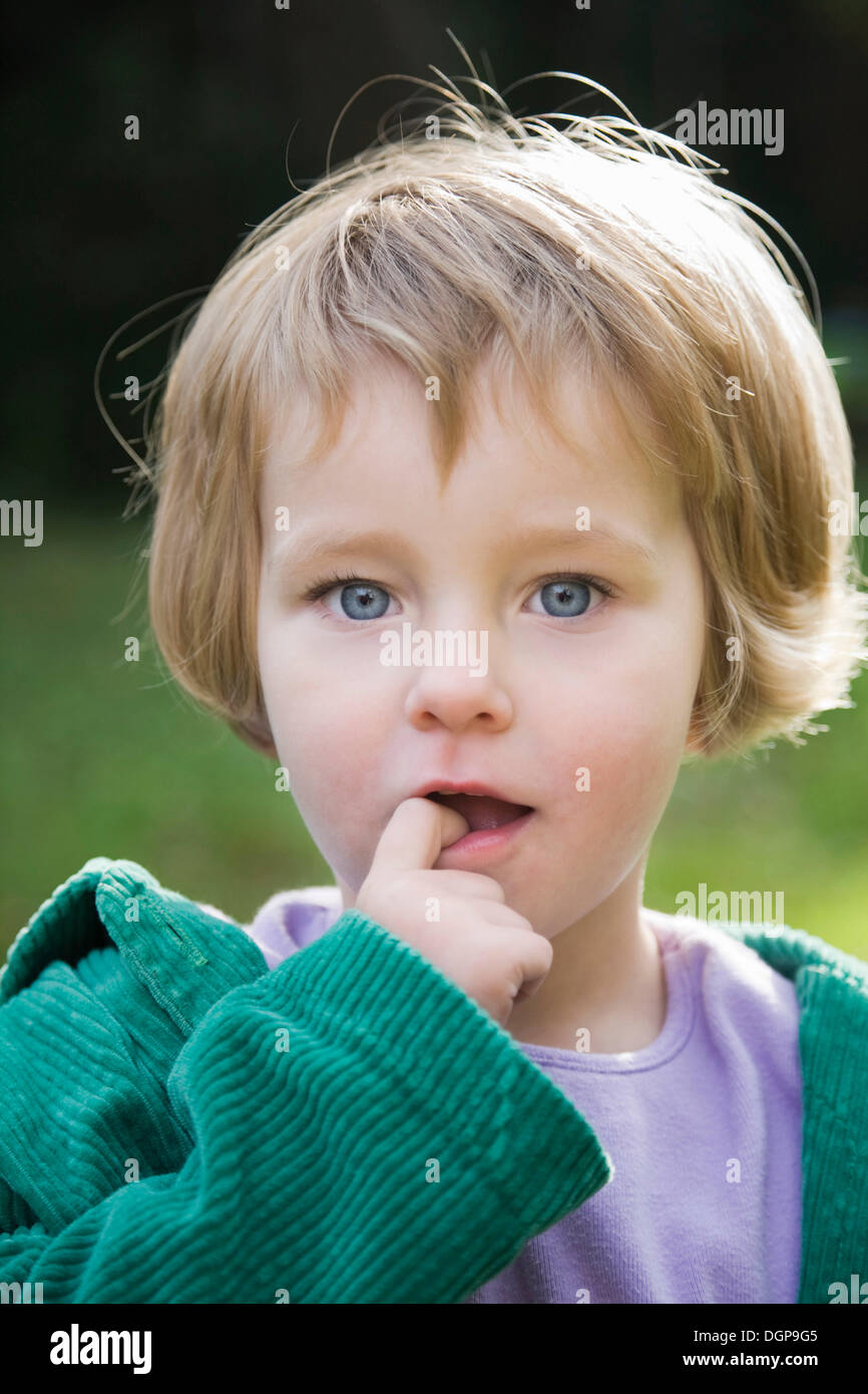 Girl with a questioning look, portrait Stock Photo - Alamy