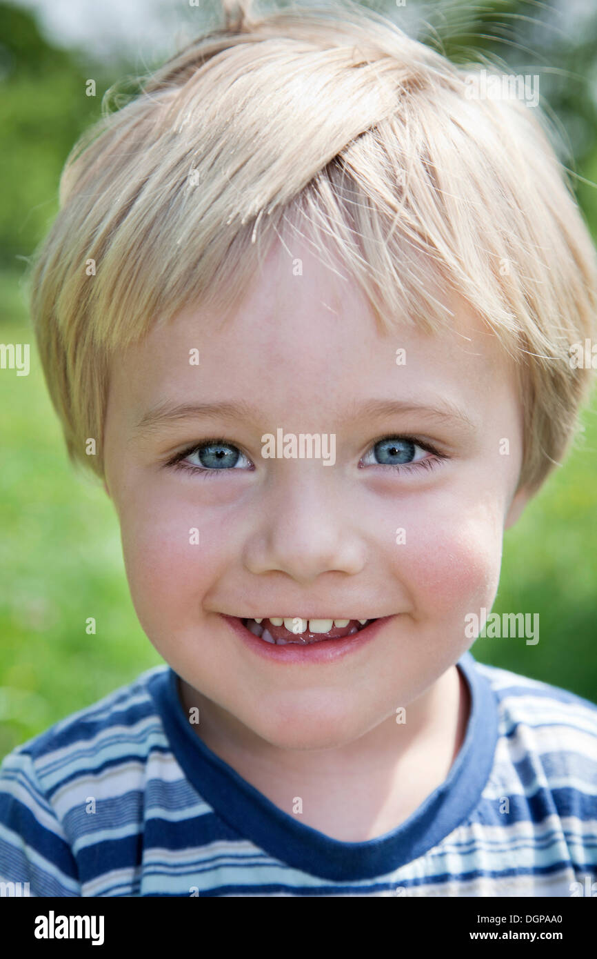 Boy with 2 photos hi-res stock photography and images - Alamy