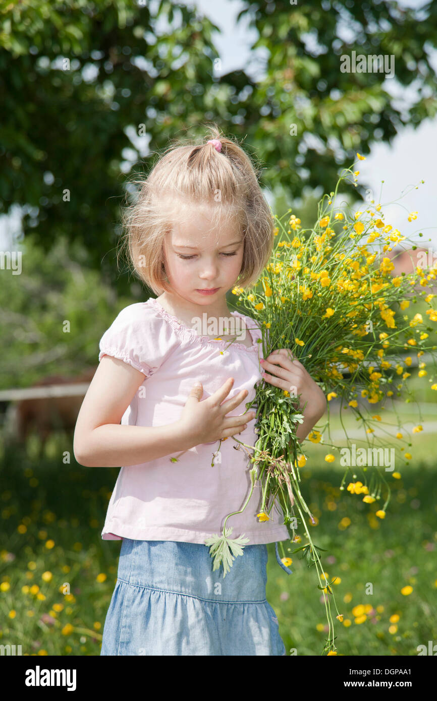 Child gathering flowers hi-res stock photography and images - Alamy