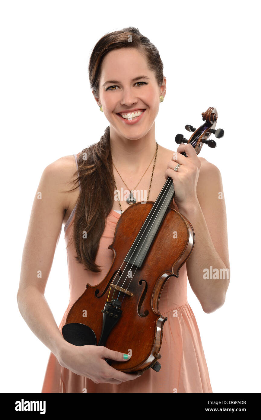 Portrait of young woman holding violin isolated over white background ...