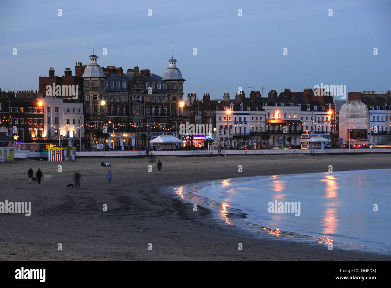 A view of Weymouth seafront Dorset at dusk with people still on the ...