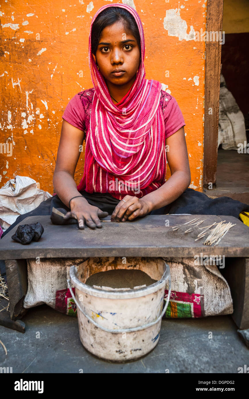 India, Mysore, Portrait of woman rolling incense Stock Photo - Alamy