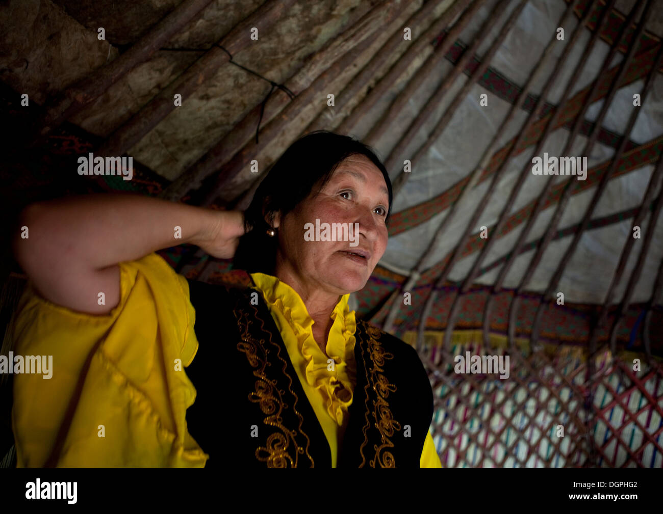 Woman In Traditional Dress In Her Yurt, Jailoo, Kyrgyzstan Stock Photo ...