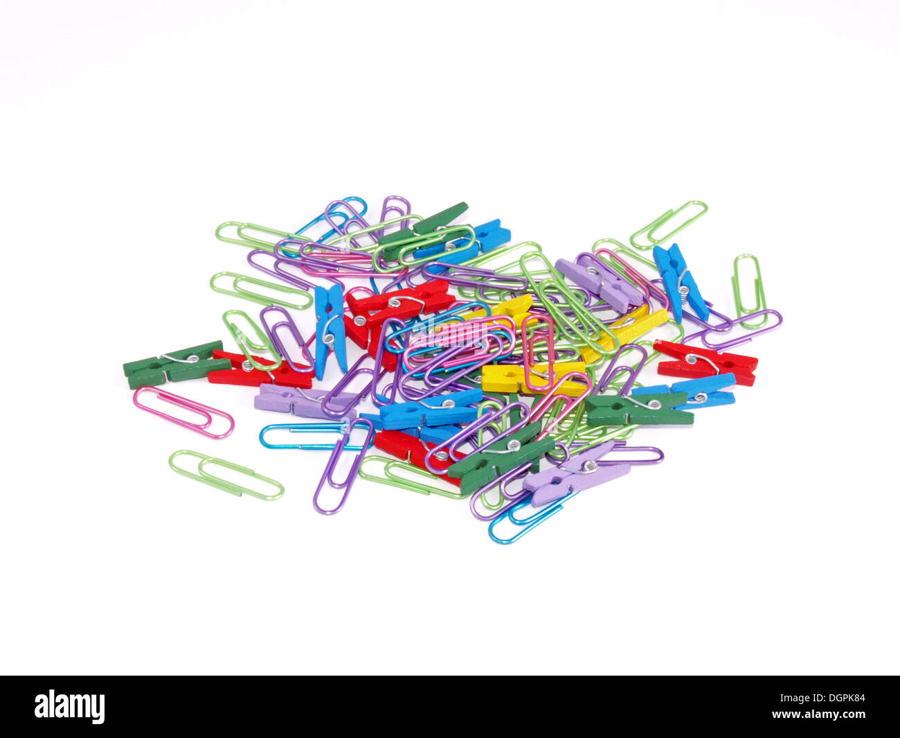 Paper clips and pegs on a white background Stock Photo - Alamy
