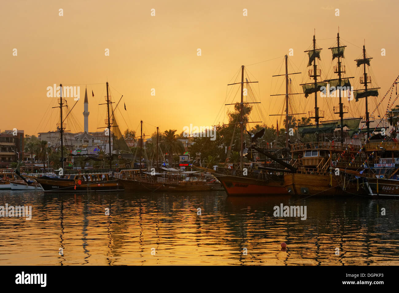 Excursion boats in the harbour in the evening light, Alanya, Turkish ...