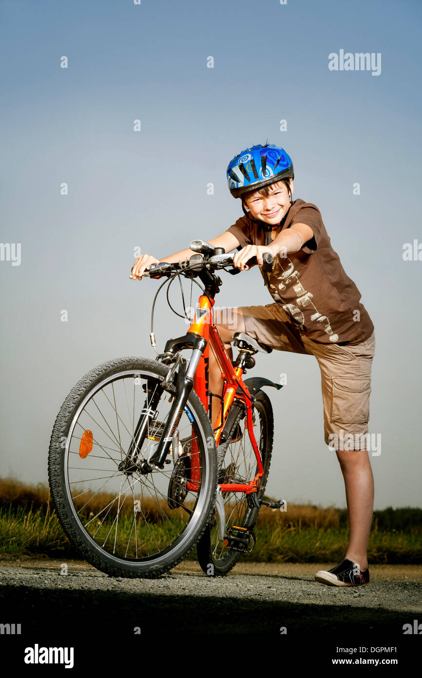 Boy riding a mountain bike Stock Photo - Alamy