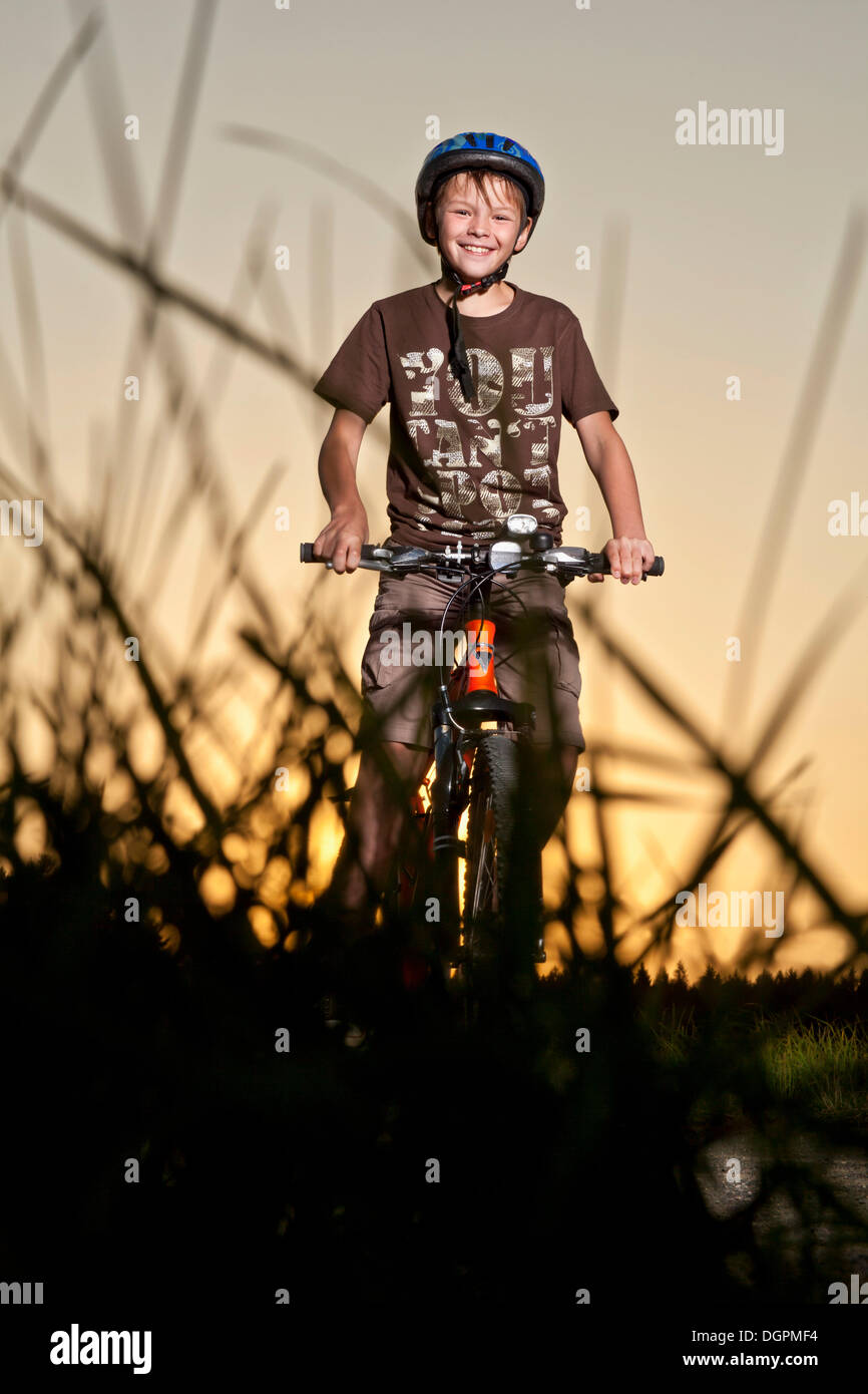 Boy riding a mountain bike Stock Photo - Alamy