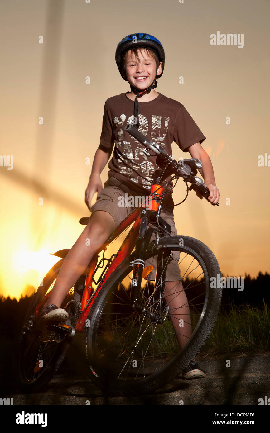Boy riding a mountain bike Stock Photo - Alamy