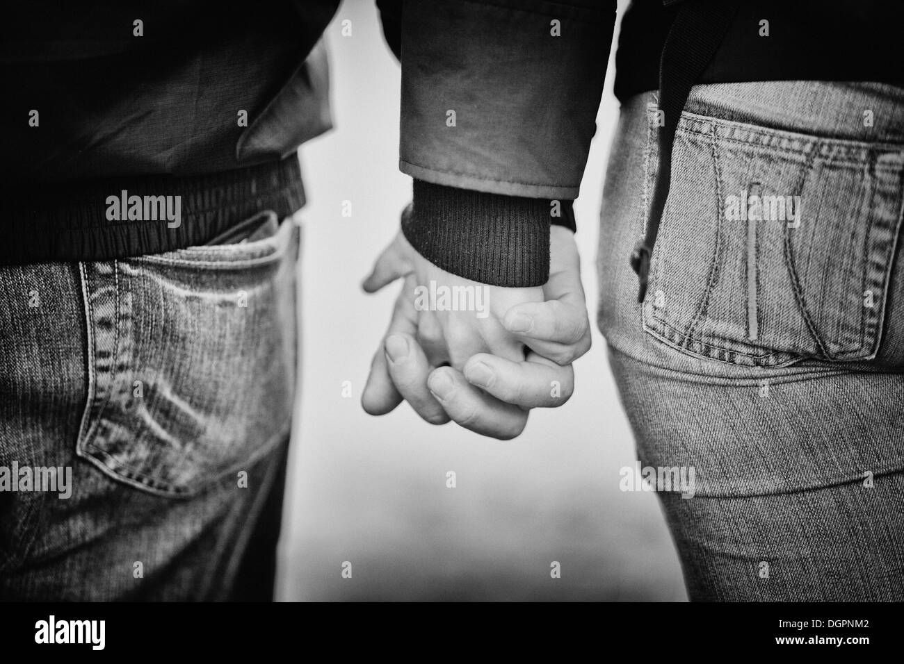 Loving couple holding each other's hands Stock Photo - Alamy