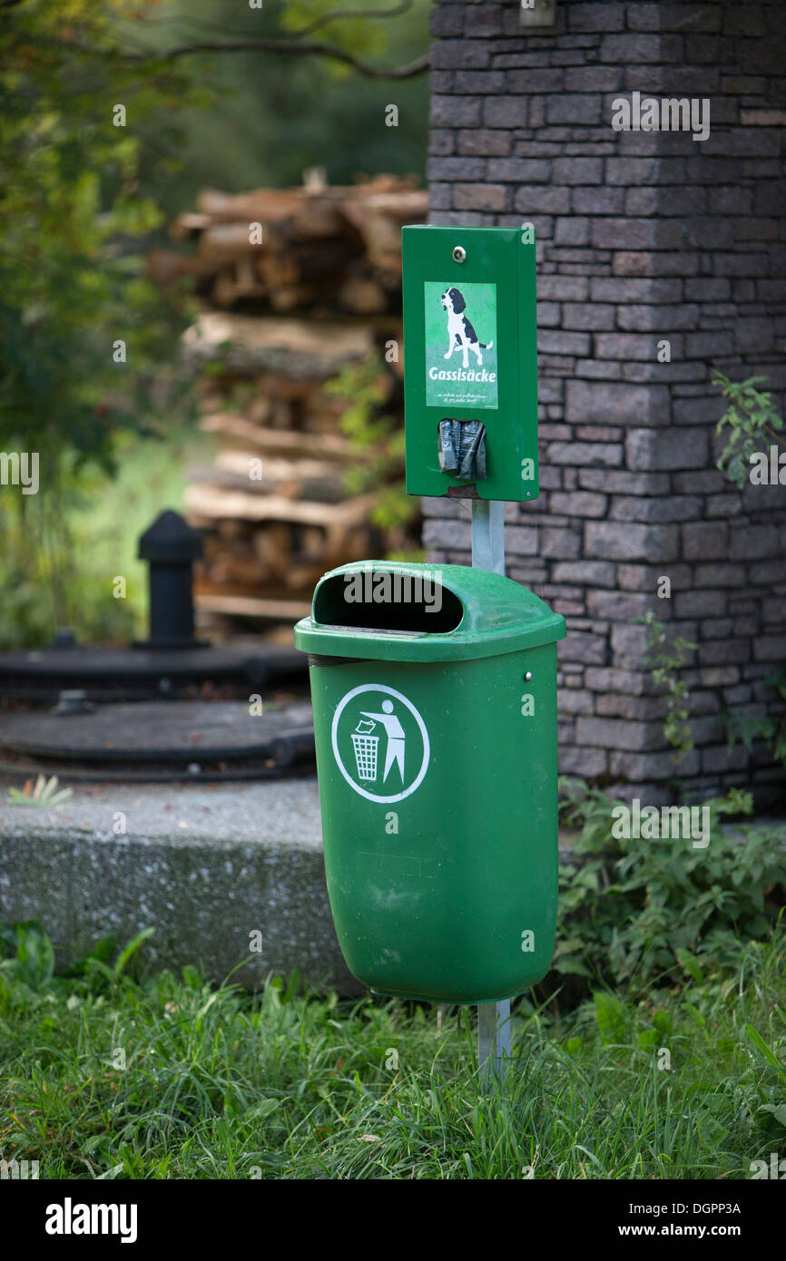 Garbage bin with organic dog waste bags in the Weissensee Nature Park ...