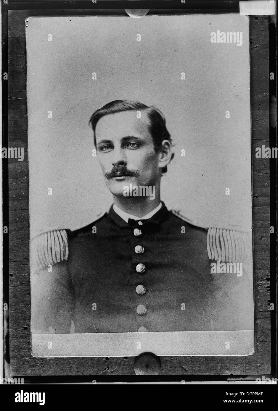 A photograph of an officer in uniform, though the specific details of ...