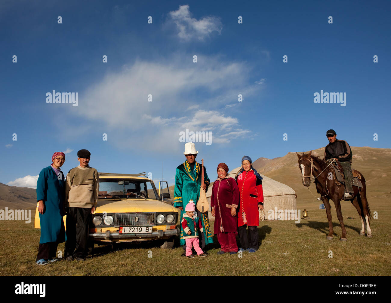Family Gathered In Front Of Their Yurt And Car, Jaman Echki Jailoo ...