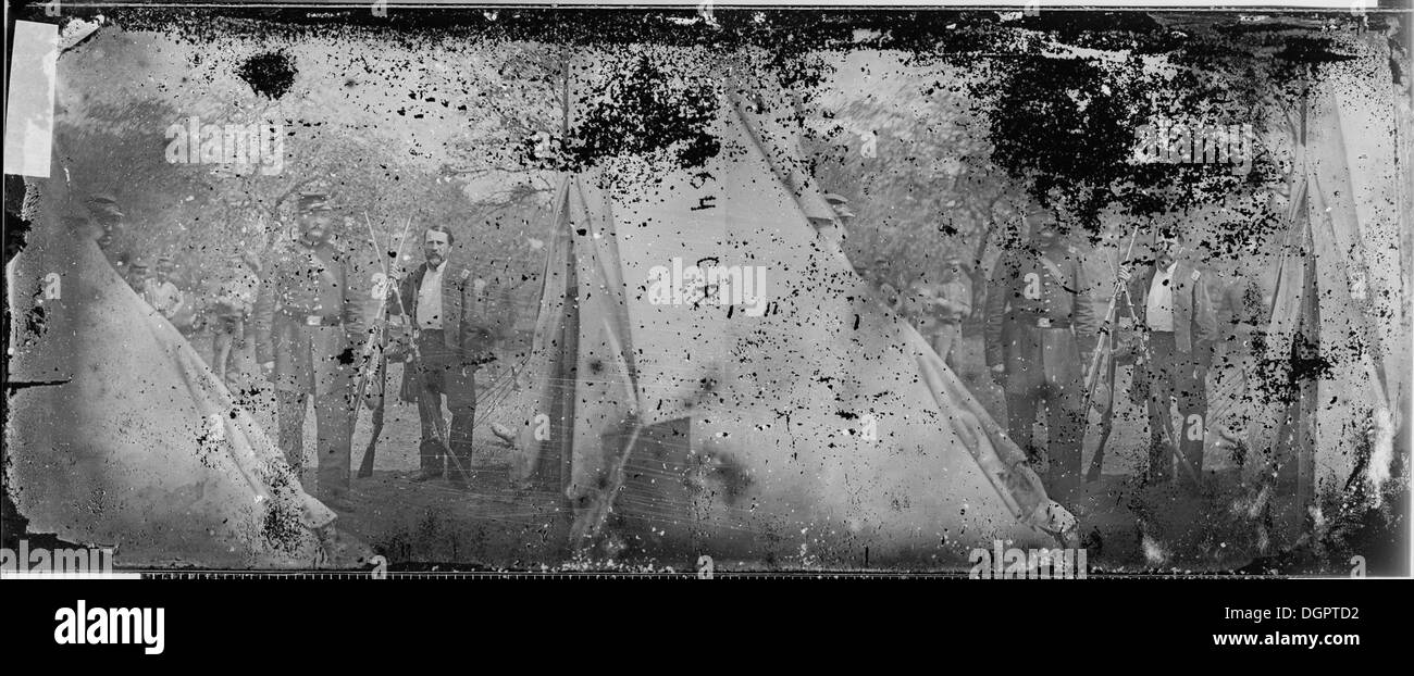 This photograph shows a group of soldiers, likely from a historical ...