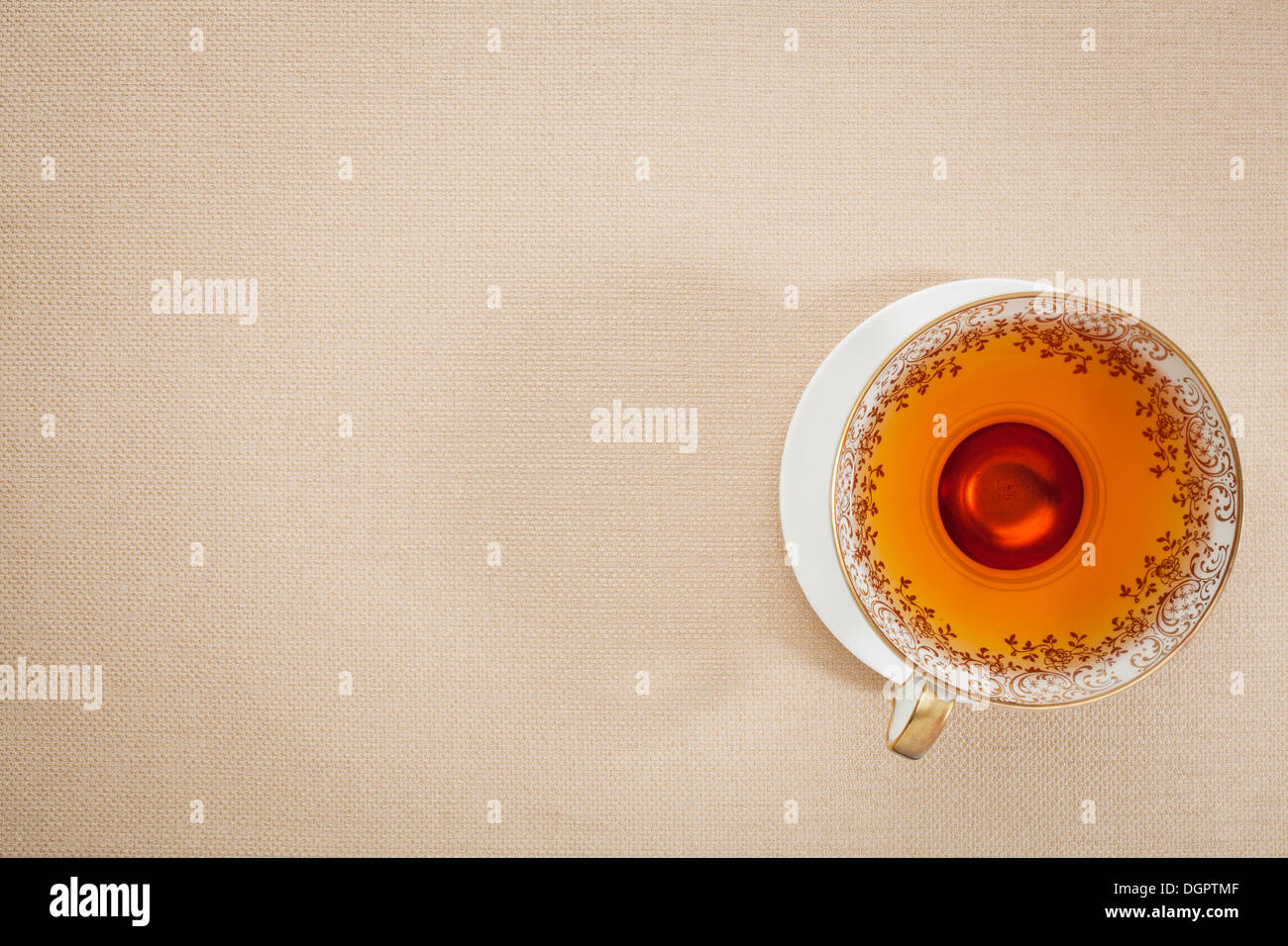 afternoon tea - top view of antique cup of black tea on canvas ...