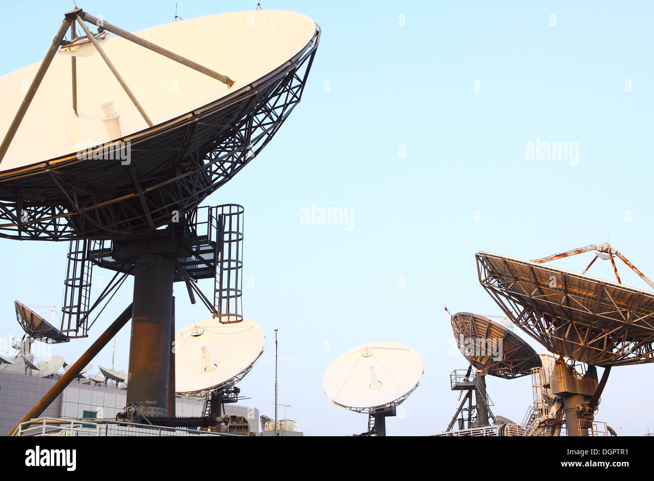 Satellite Communications Dishes on top of TV Station Stock Photo - Alamy