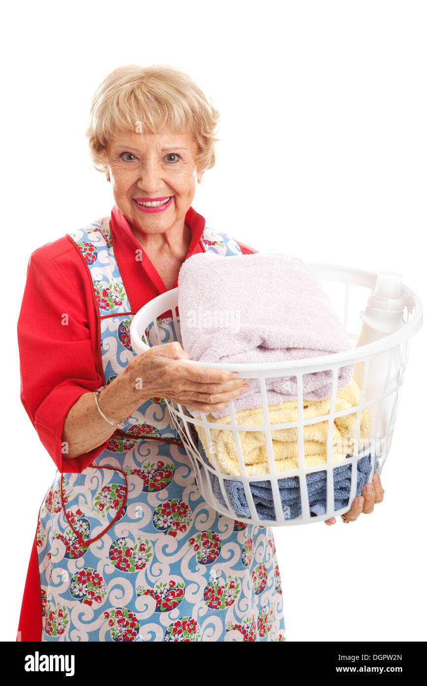 Beautiful senior woman in her apron, doing the laundry. Isolated on ...
