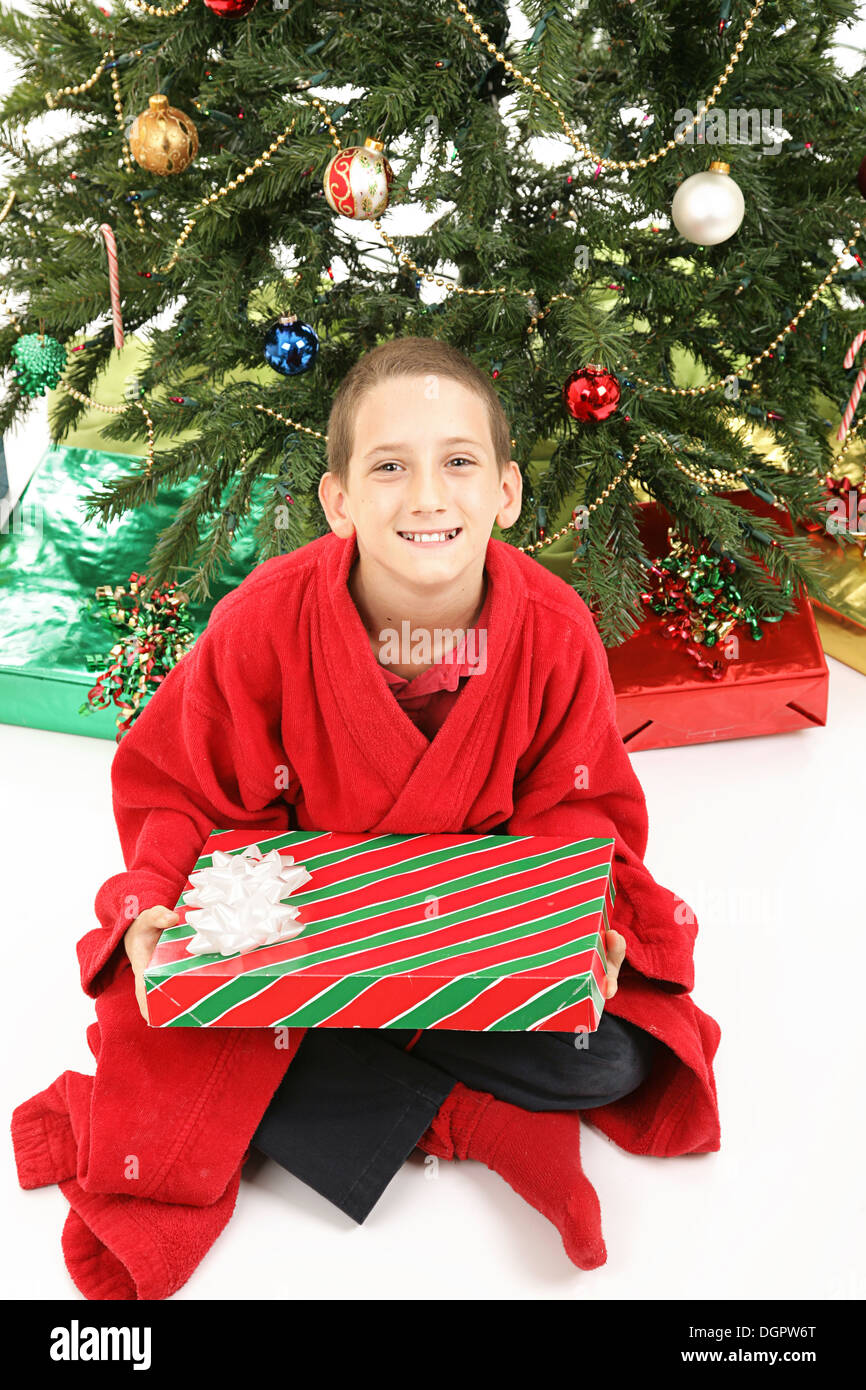 Cute little boy on Christmas morning, eager to open his gifts Stock ...