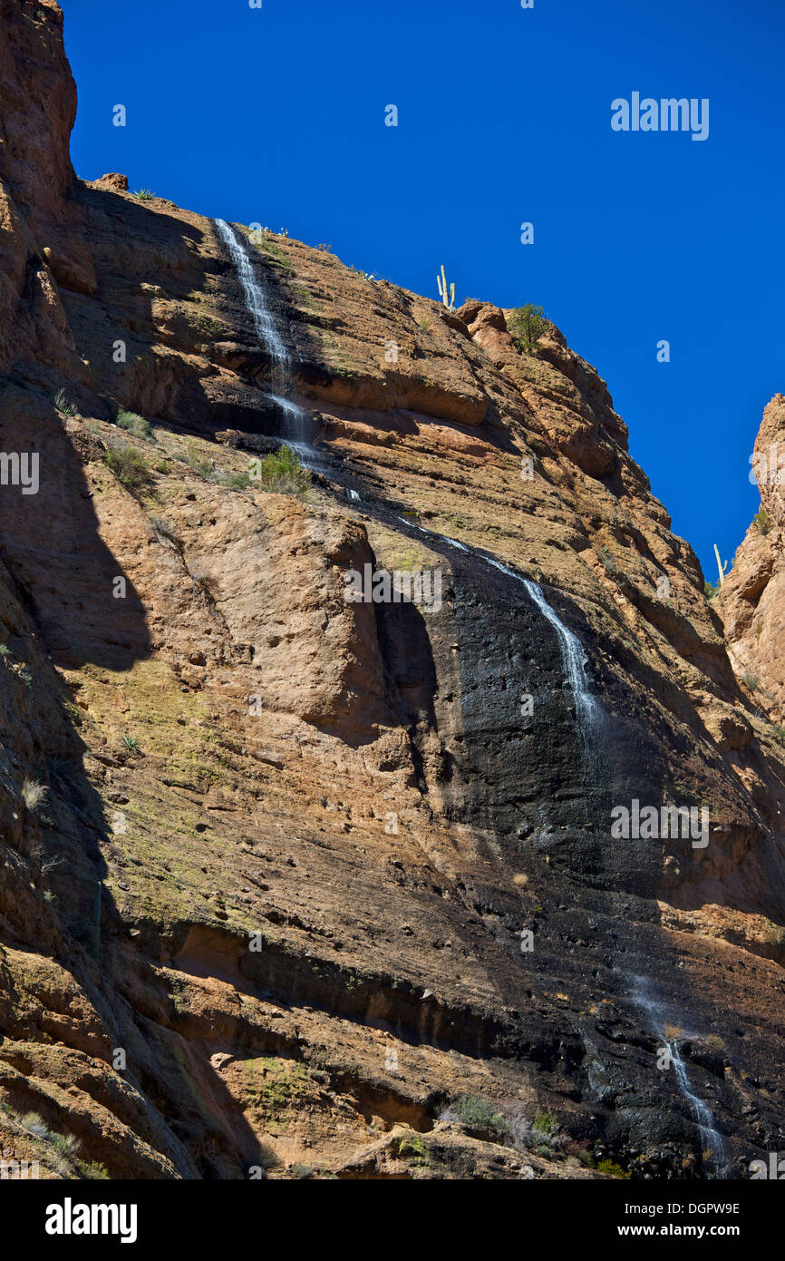 Waterfall along the Apache Trail, Arizona. Cacti highlighted against ...