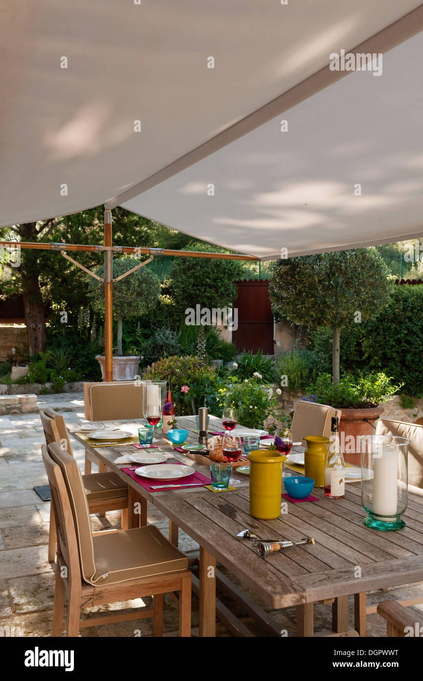Al fresco dining. Sun-shade, table and chairs all by Tectona Stock ...