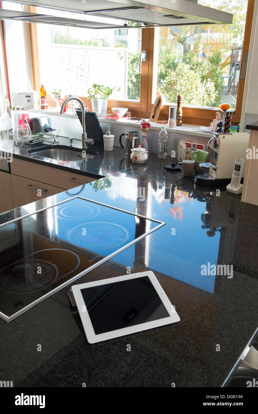 Tablet on the kitchen counter Stock Photo - Alamy