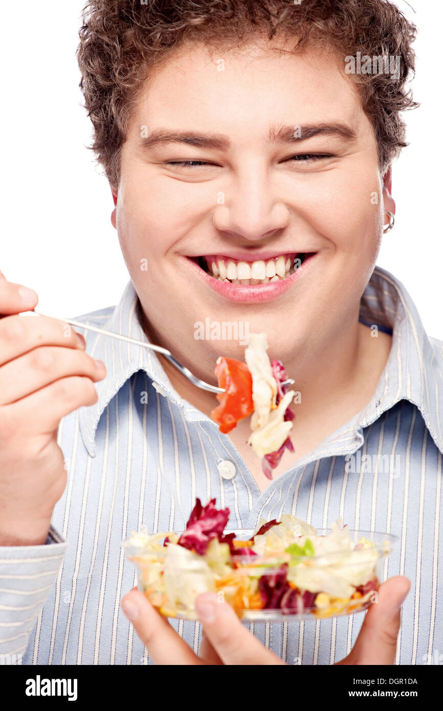 Happy chubby young man eating hi-res stock photography and images - Alamy