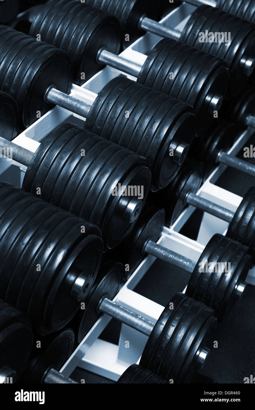 Heavy sports dumbbells Stock Photo - Alamy