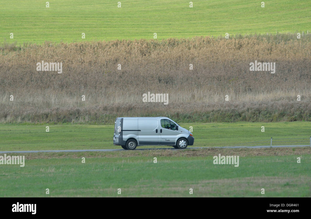 Van driving on a local road Stock Photo - Alamy
