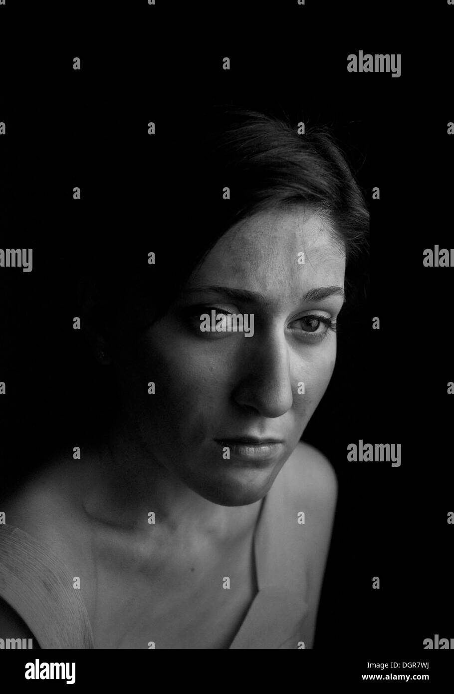 Somber studio portrait of a girl Stock Photo - Alamy