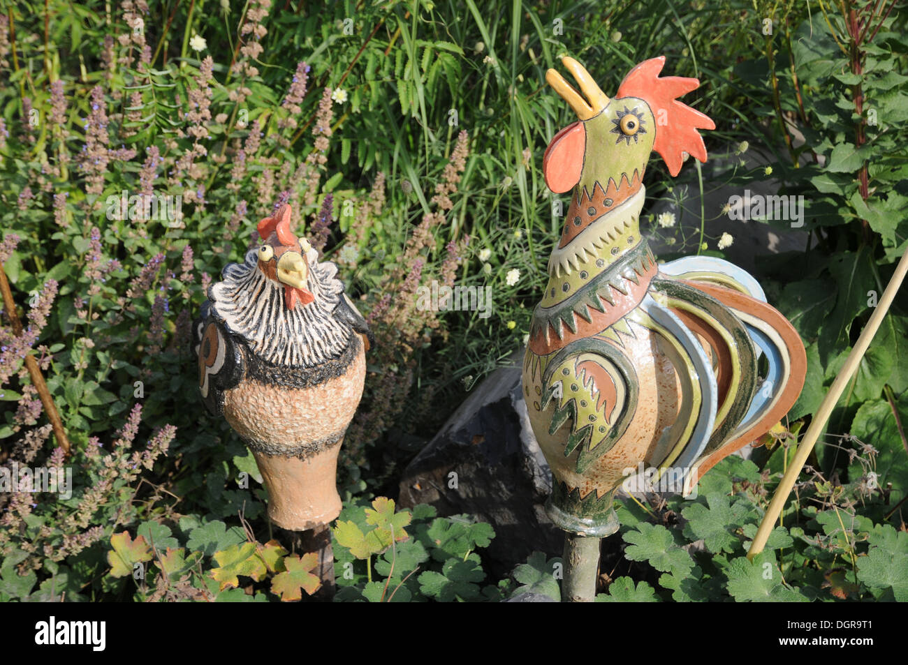 Cock and hen made of earth Stock Photo - Alamy