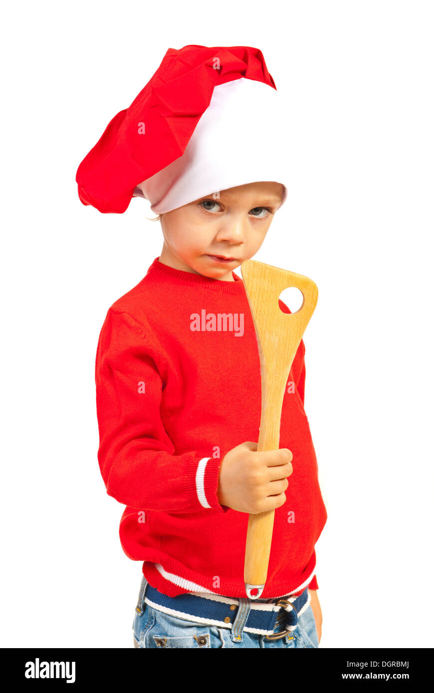 Toddler chef holding wooden utensil isolated on white background Stock ...