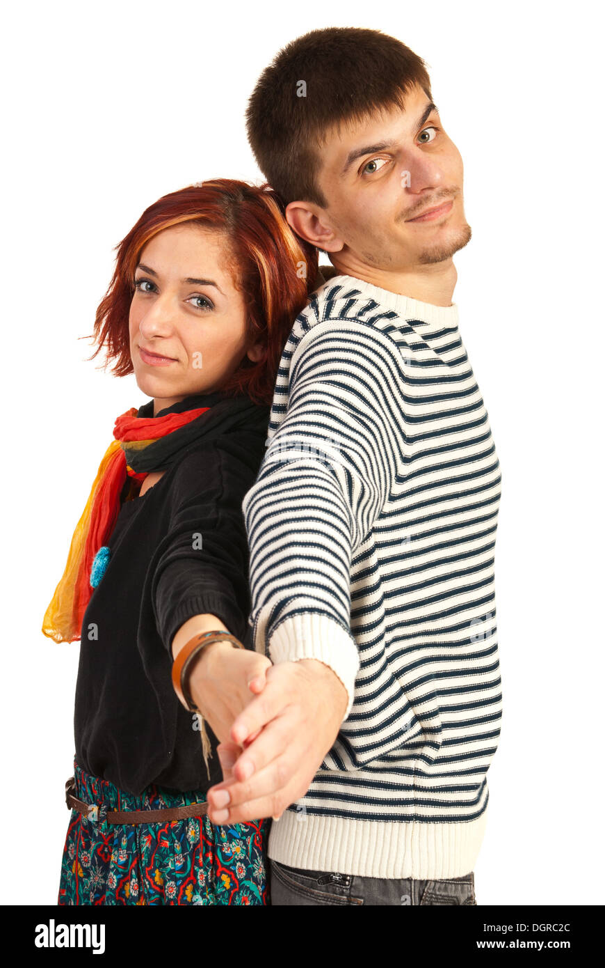 Happy young couple holding hands in front of camera isolated on white ...