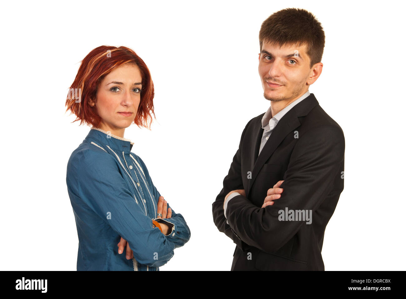 Two young business people standing with arms folded isolated on white ...