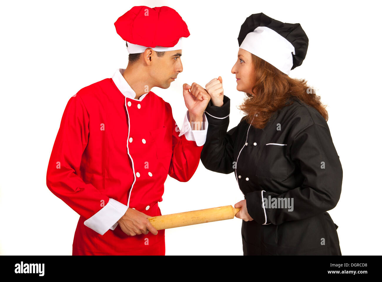 Chefs couple arguing and showing each other fist isolated on white ...