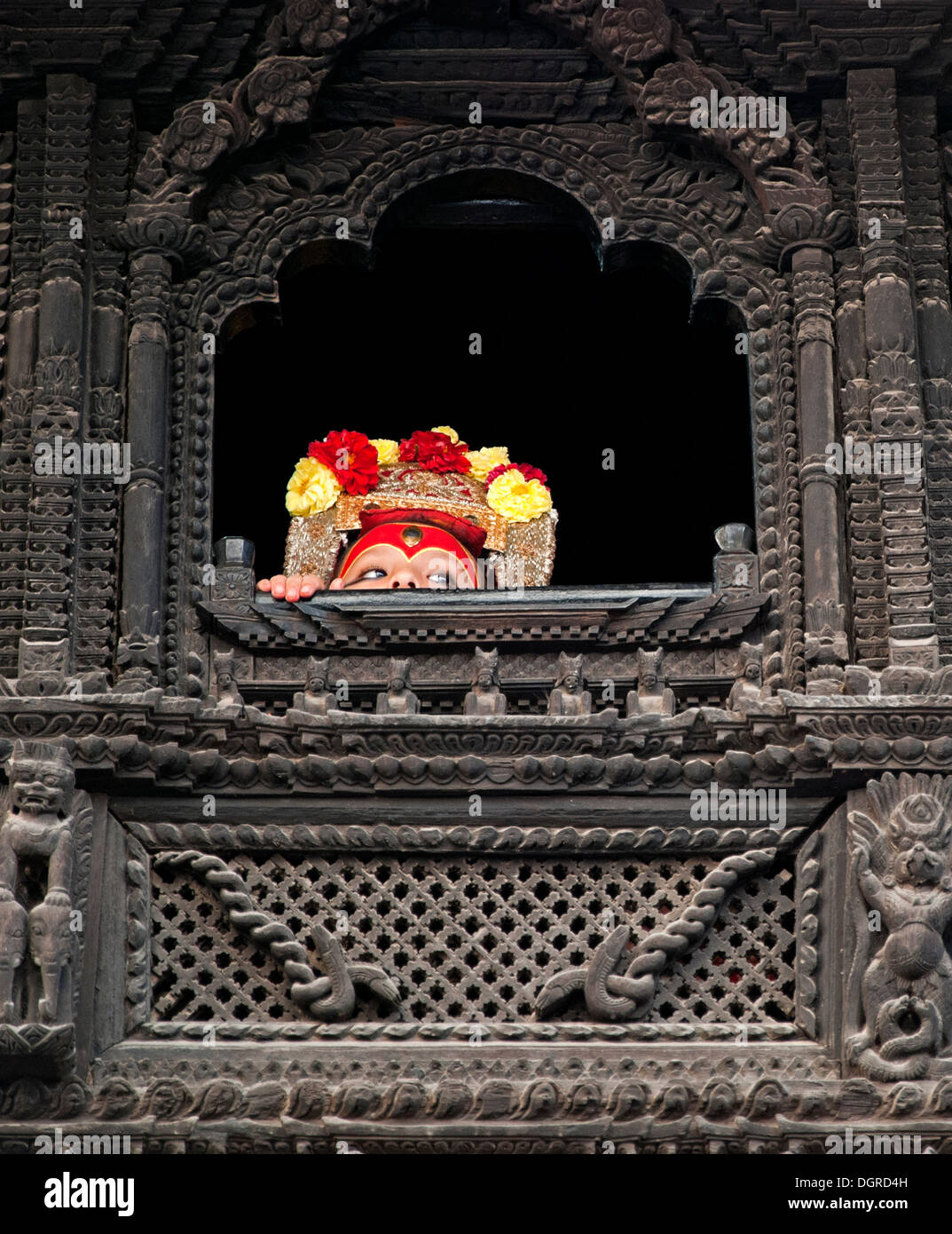Living god of Kathmandu peeping from a wood carved window Stock Photo ...