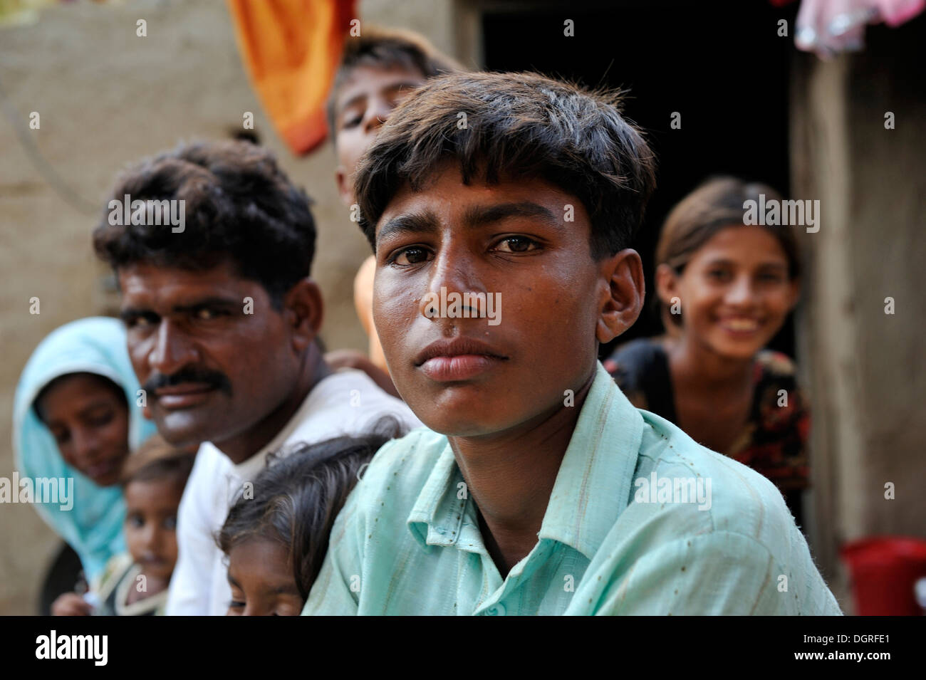 Pakistan, Lahore, Youhanabad II, Teenage boy with family Stock Photo ...