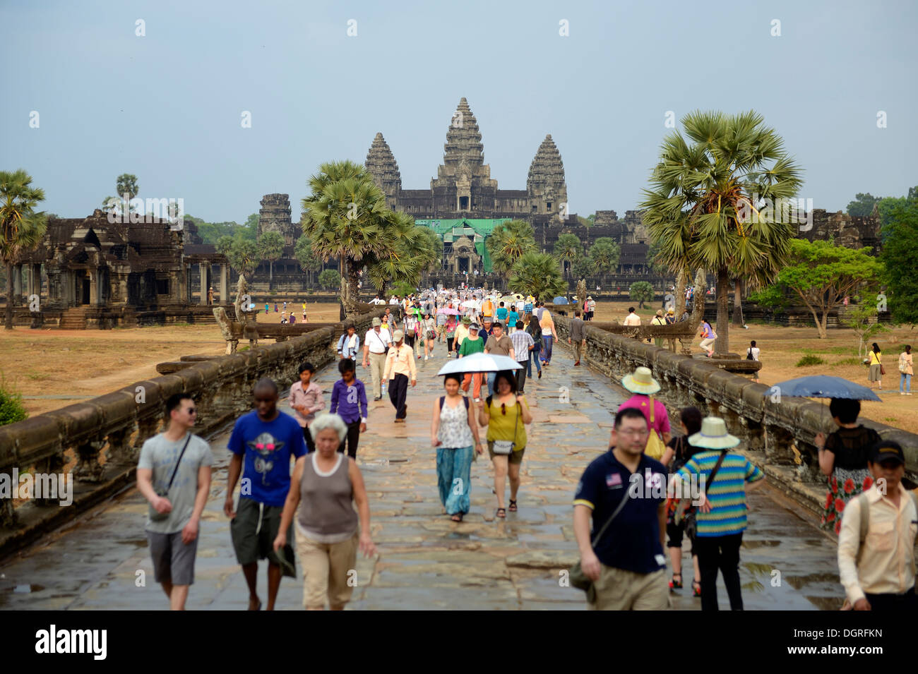 Cambodia, Siem Reap, Angkor Wat, Tourists visiting the temple complex ...