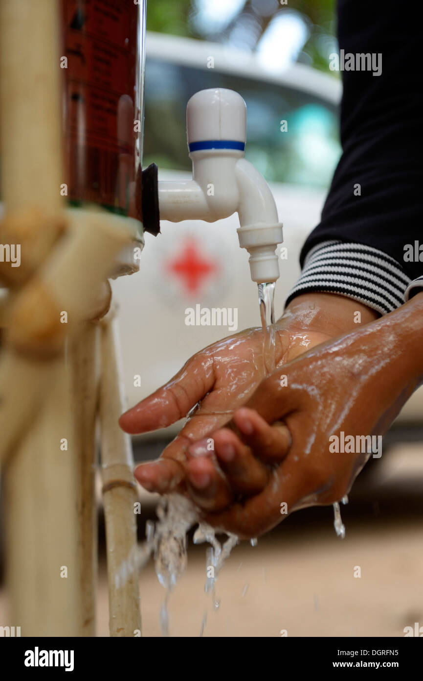 Washing hands tap cambodia hi-res stock photography and images - Alamy