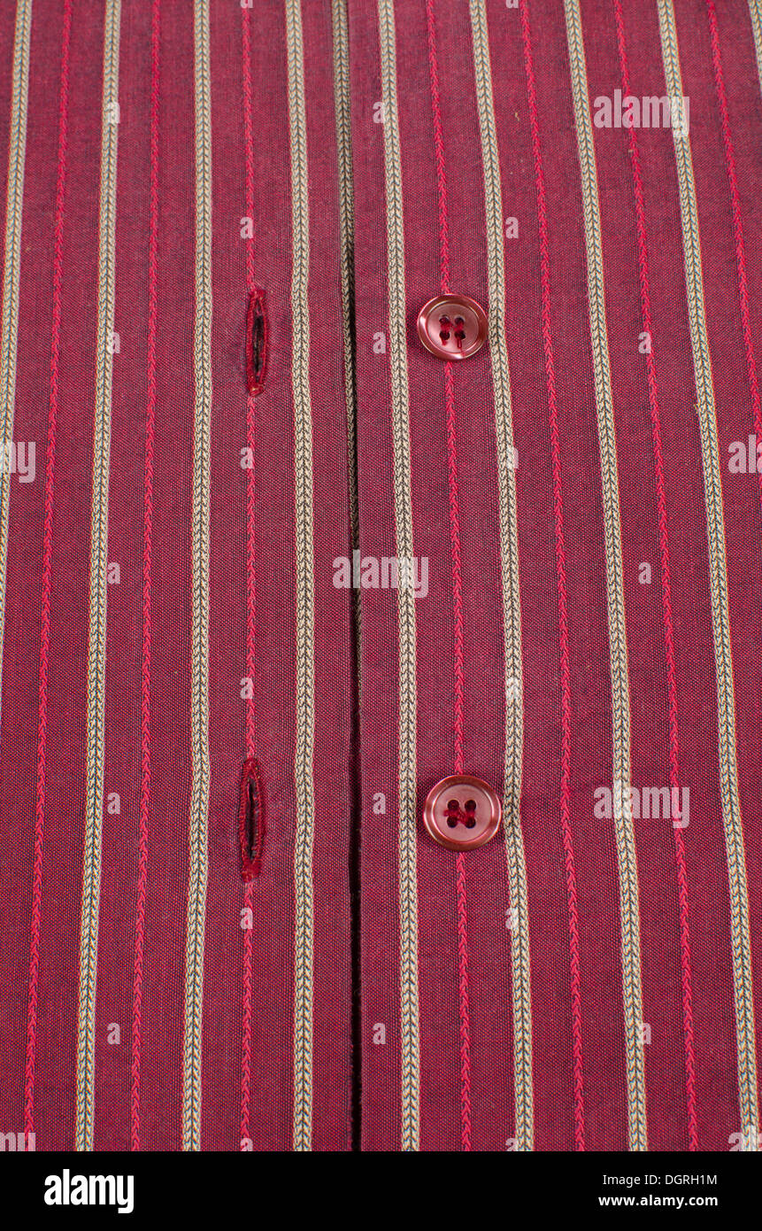 Striped cotton fabric with buttons and buttonholes Stock Photo - Alamy