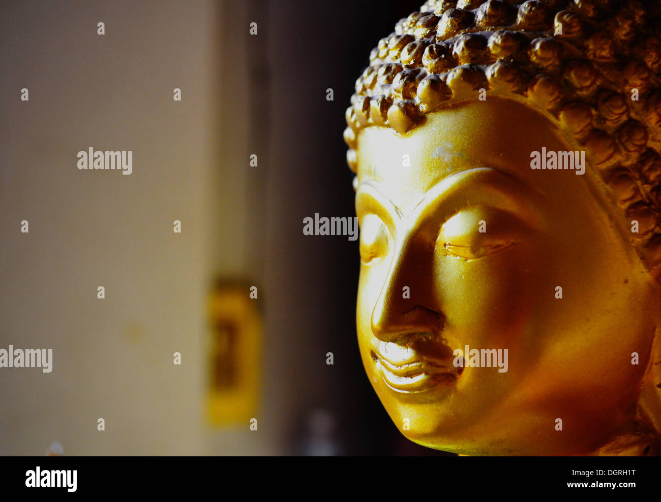 Beautiful golden face of Buddha statue Stock Photo - Alamy