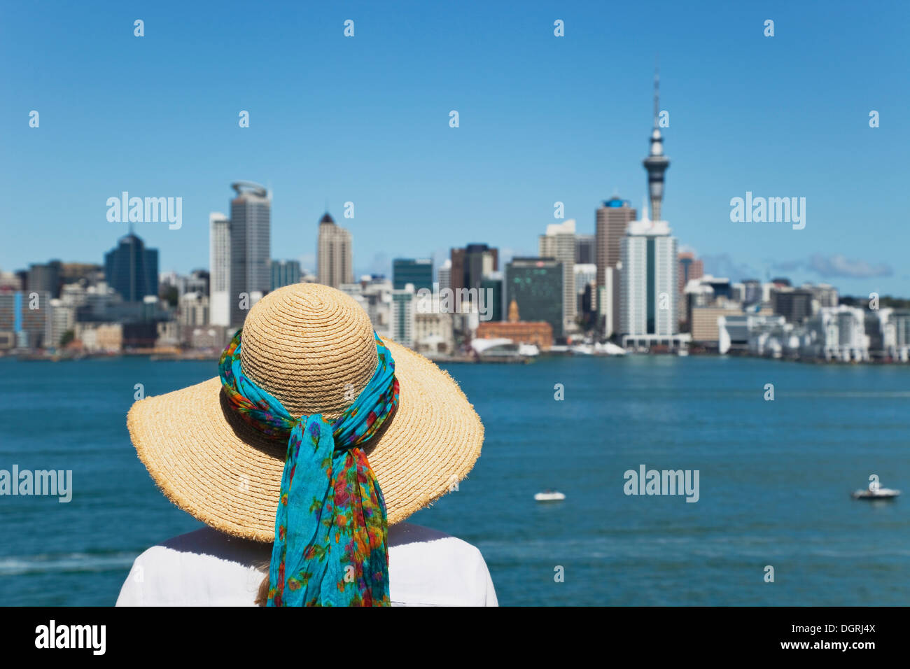 New Zealand, Woman looking at Auckland skyline Stock Photo - Alamy