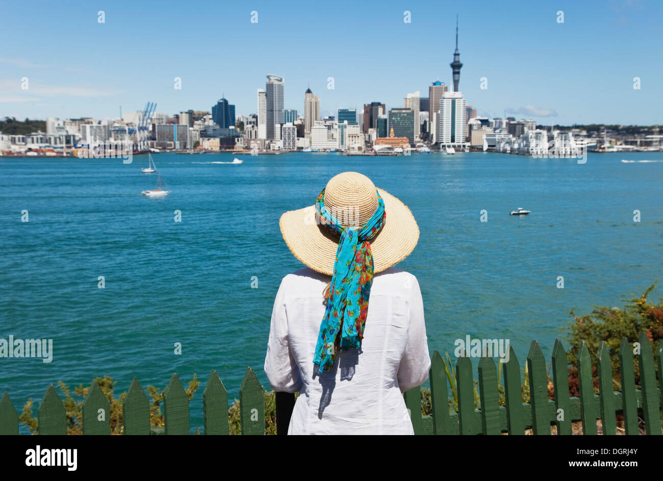 New Zealand, Woman looking at Auckland skyline Stock Photo - Alamy