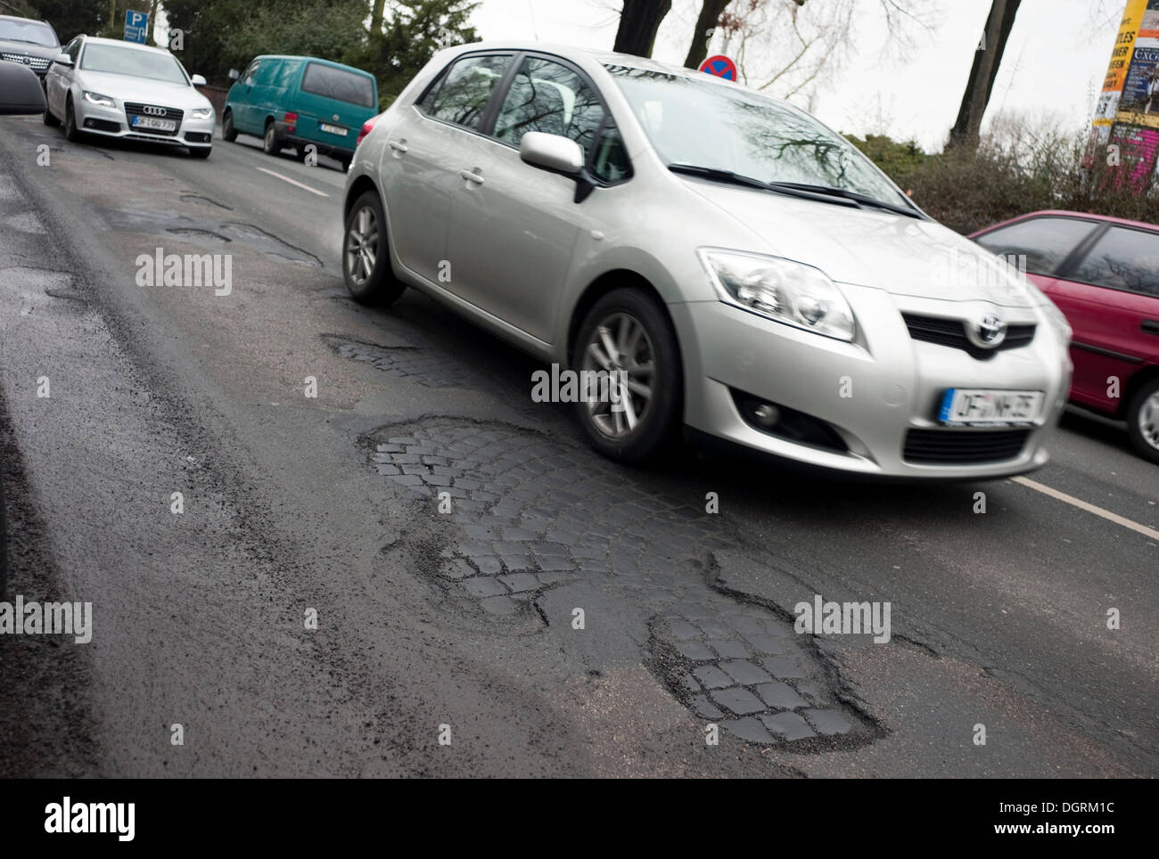 Frost damage, potholes in the road surface, Germany Stock Photo - Alamy